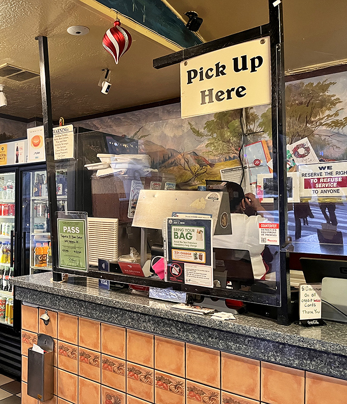 The "Pick Up Here" sign – three simple words that mark the threshold between hunger and happiness for countless takeout devotees.