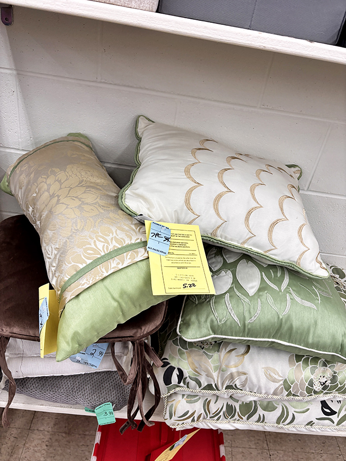 Decorative pillows with price tags still attached &ndash; the universal symbol of "I bought this on impulse and never found the right spot."