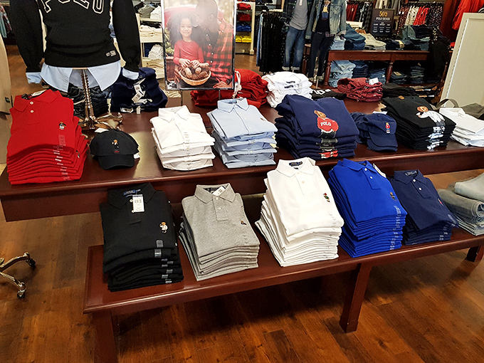 Polo shirt paradise where preppy meets practical. This color-coordinated display is what your closet dreams of becoming when it grows up.