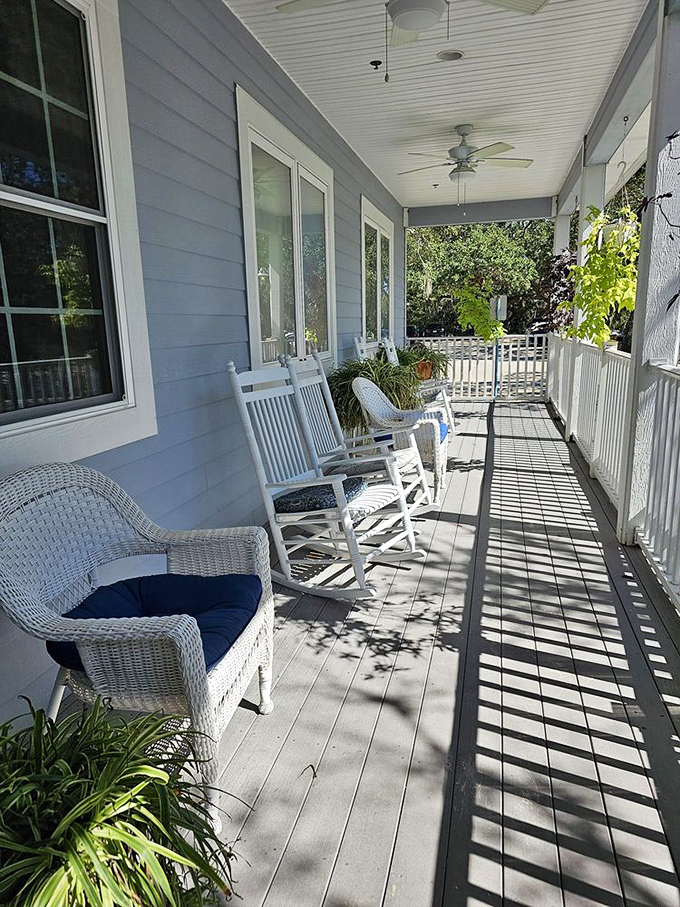 The front porch rocking chairs aren't just seating – they're time machines to a slower, more civilized era of pre-dinner relaxation.