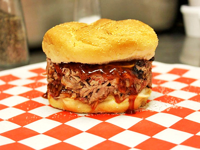 A pulled pork sandwich that doesn't just sit on the bun&mdash;it commands it, with sauce dripping like the tears of joy you'll shed.