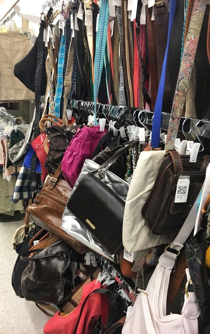 The handbag collection &ndash; leather treasures hanging like exotic fruit, each with stories of dinners out and special occasions past.