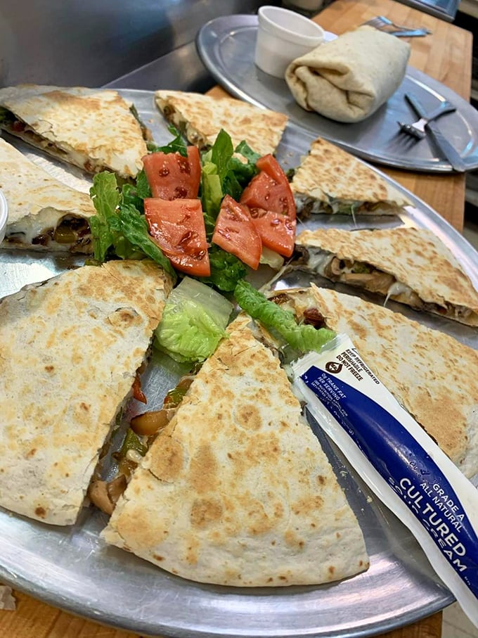 Quesadillas with attitude—crispy, stuffed to capacity, and arranged like a sunburst of flavor. The perfect shareable that nobody actually wants to share.