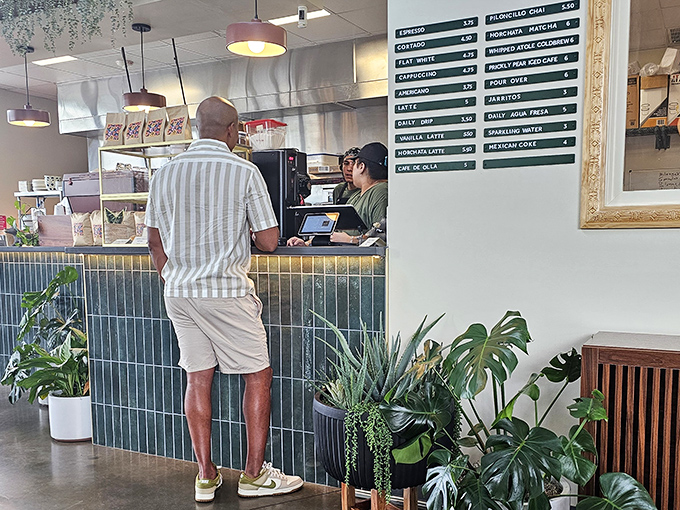 The coffee counter &ndash; command central for caffeine dreams and morning revelations. That menu board holds the key to starting your day right.