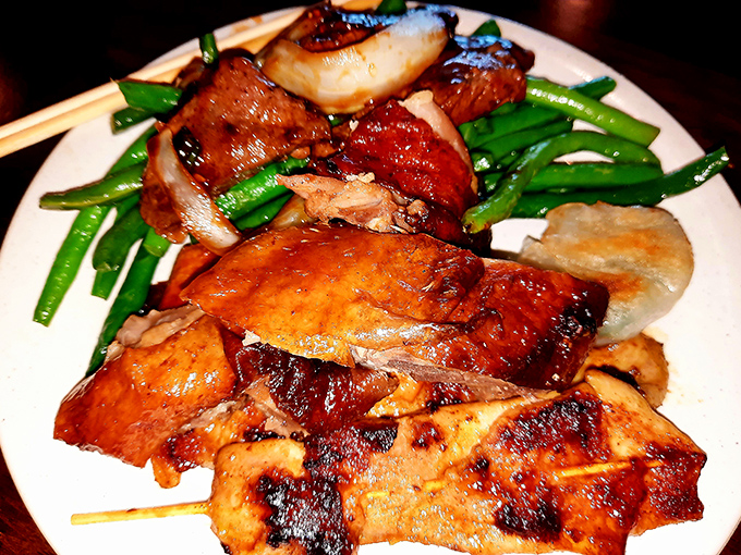 Roasted duck glistens with lacquered perfection alongside vibrant green beans&mdash;proof that buffets can indeed rise above their reputation.