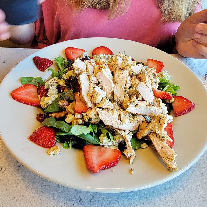 A salad that doesn't apologize for being healthy. Fresh strawberries, grilled chicken, and greens that actually look like they want to be eaten.