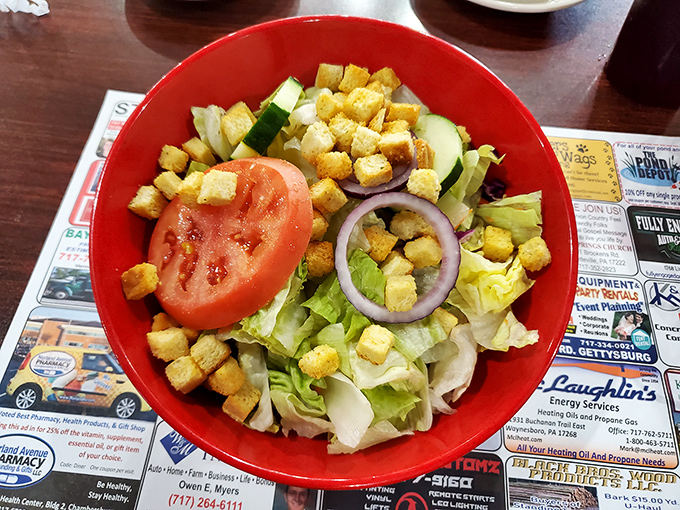 This garden-fresh salad in its cheerful red bowl proves that diners can do healthy options without sacrificing flavor or generous portions.