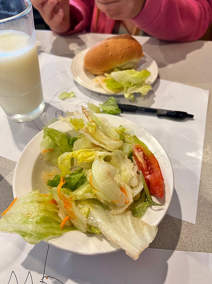 Fresh salad providing the token vegetable moment before you dive back into the carb-loaded main event.