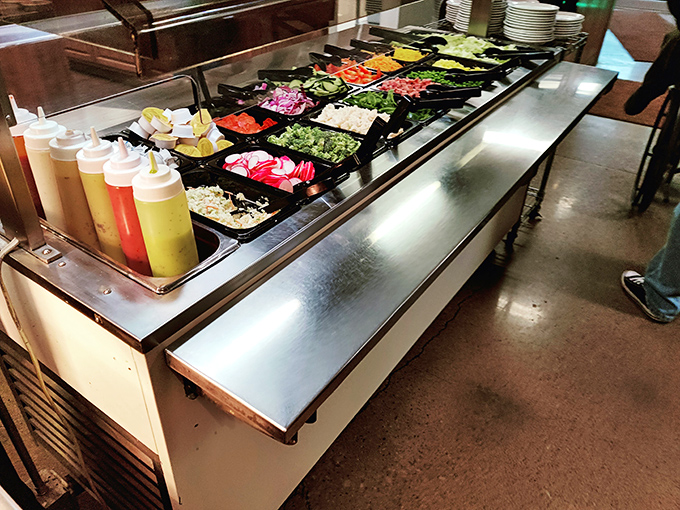 A salad bar that understands its mission: provide token vegetables while ensuring multiple paths to delicious indulgence.