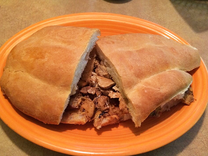 This torta isn't just a sandwich&mdash;it's an architectural marvel of bread and filling that requires both hands and your complete attention.