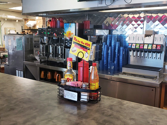 The beating heart of any proper diner &ndash; where condiments stand ready for duty and coffee flows like a caffeinated river of dreams.