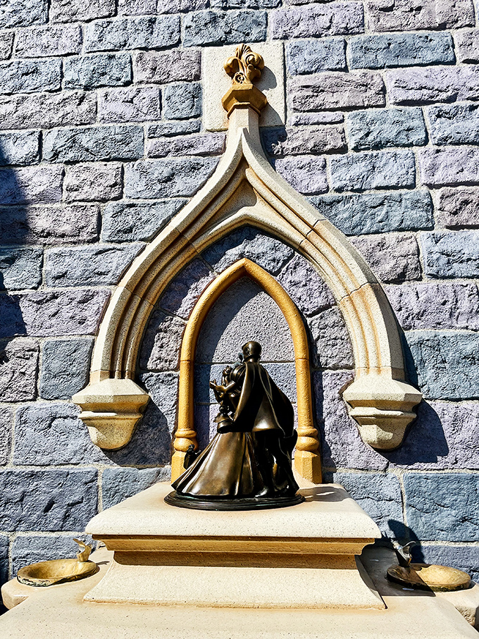 Architectural details like this Gothic-inspired archway showcase the craftsmanship that elevates theme parks into immersive art.