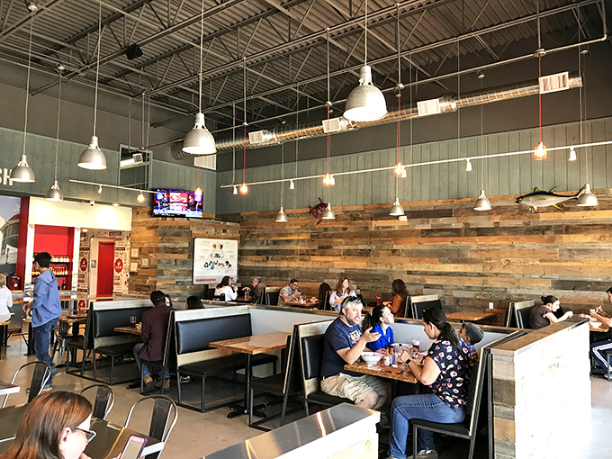 Where seafood enthusiasts gather &ndash; rustic wood walls and industrial lighting create the perfect backdrop for the "oohs" and "aahs" of satisfied diners.