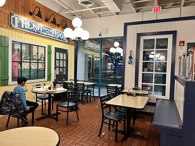 Cozy seating with yellow and turquoise accents creates that beachy feeling without sand in uncomfortable places.