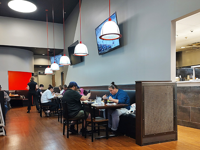 Modern pendant lighting illuminates conversations worth having, in a dining room designed for lingering long after plates are cleared.