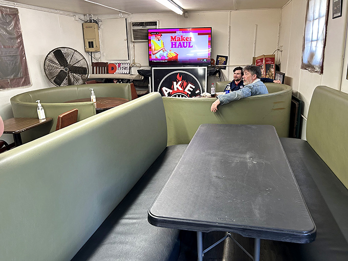 The dining room at Jake's proves my theory: inverse relationship between d&eacute;cor budget and food quality. These booths have cradled countless BBQ euphoria moments. 
