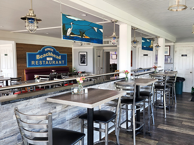 Nautical-inspired dining spaces that feel like the captain's quarters of a very tasteful ship. Those pendant lights cast the perfect glow for seafood appreciation.