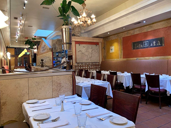 White tablecloths and warm lighting create the perfect backdrop for food romance. Every table tells a story&mdash;yours is about to begin.