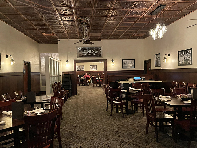 The dining room waits expectantly for the evening's guests, each table a stage for memorable meals and conversations.