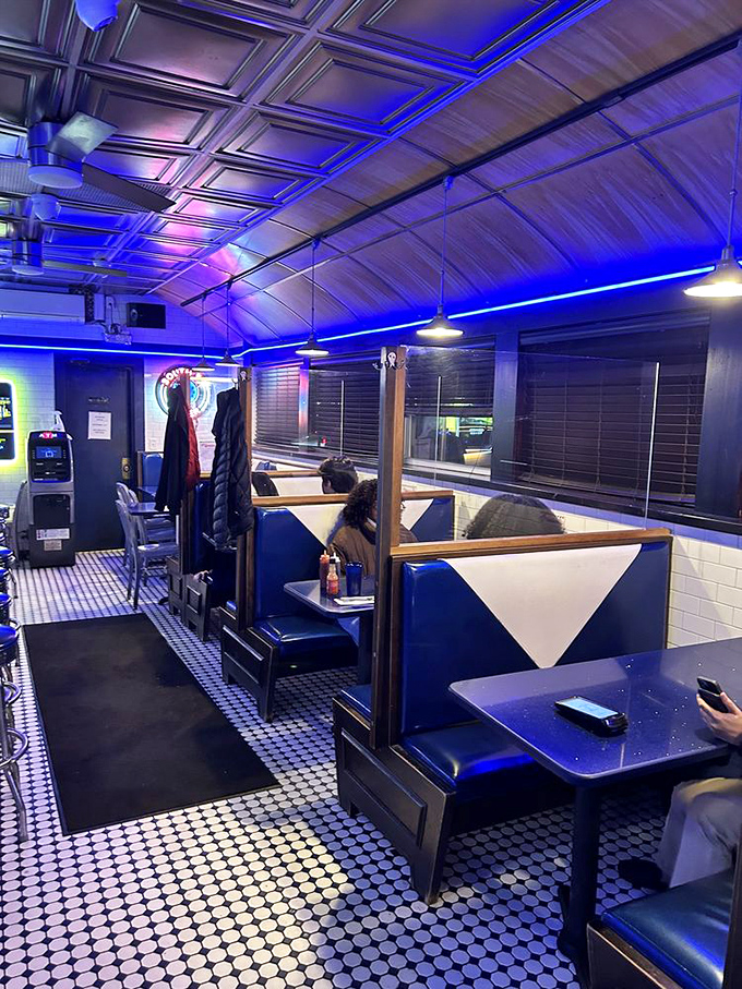 Blue booths that have cradled everything from first dates to philosophical debates at 4 AM. Comfort comes standard here.