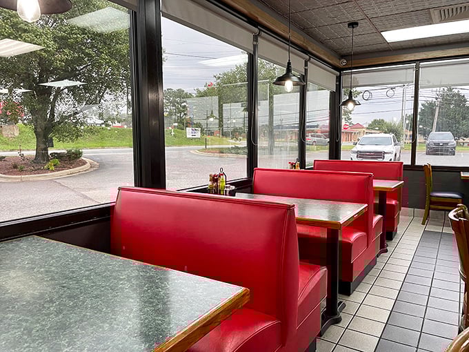 Window booths bathed in natural light &ndash; where red vinyl seating has cradled countless conversations and comfort food moments through the years.