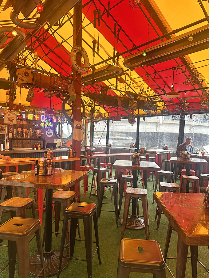Indoor seating under that iconic striped tent means comfort and atmosphere regardless of what New England weather decides to do.