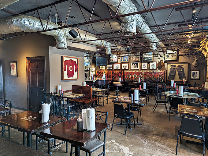 Simple tables and chairs in a room adorned with local sports memorabilia &ndash; because great barbecue doesn't need fancy surroundings to shine.
