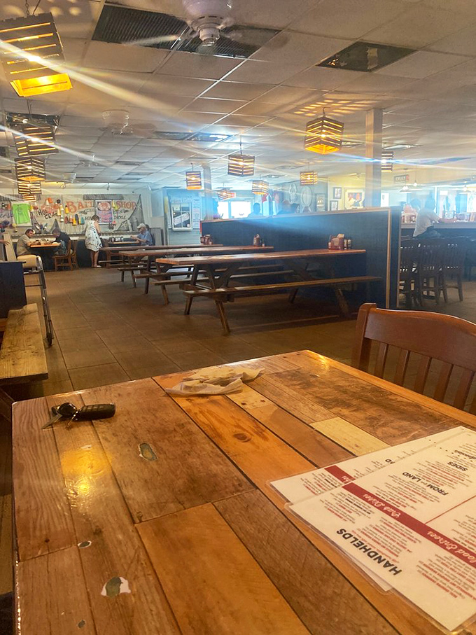 Rustic wooden tables that have heard thousands of "mmms" and "you've got to try this." Each scratch tells a seafood story.
