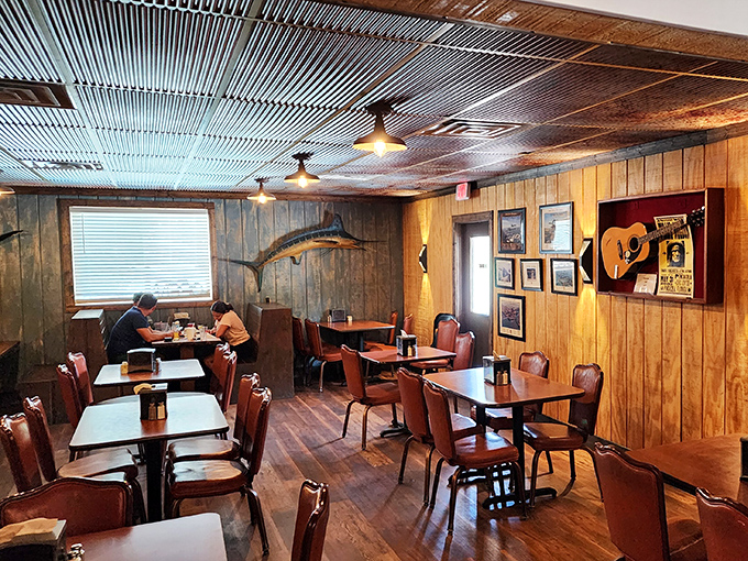 Wood-paneled walls adorned with fishing trophies create the perfect backdrop for seafood that tastes like it jumped straight from water to plate.