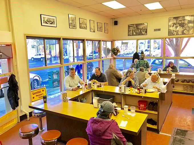 The U-shaped counter creates a democratic dining experience where judges sit next to janitors and everyone gets the same great service.