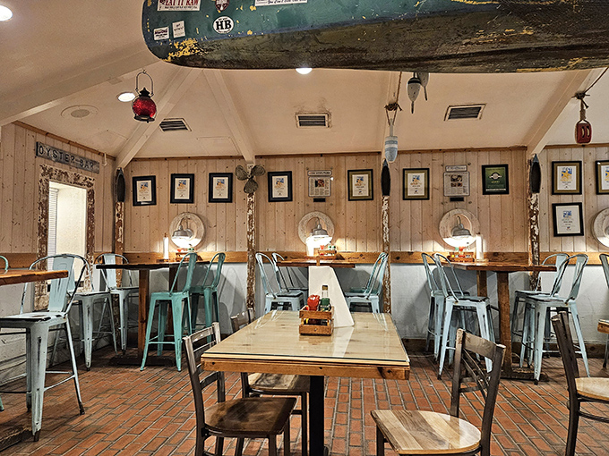 The dining room balances nautical charm with casual comfort&mdash;those framed accolades on the wall aren't just decoration, they're spoiler alerts.