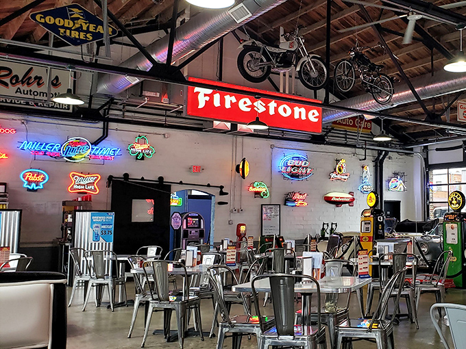 Neon signs illuminate the dining room like the world's most delicious art gallery. Even the motorcycles look hungry.