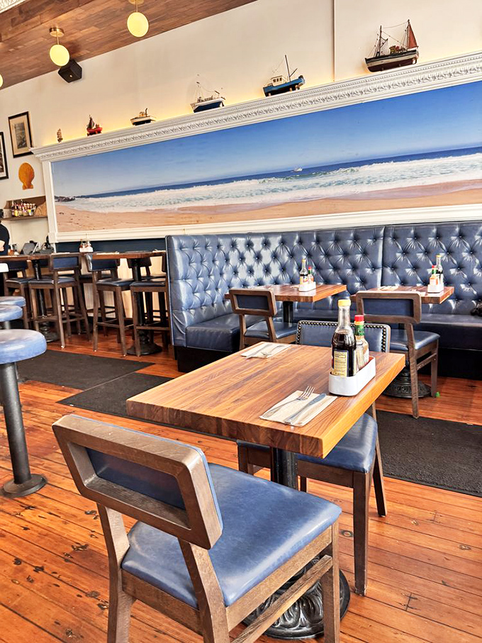 Navy blue banquettes against warm wood tables with that beach panorama&mdash;it's like dining in a stylish captain's quarters without the seasickness.