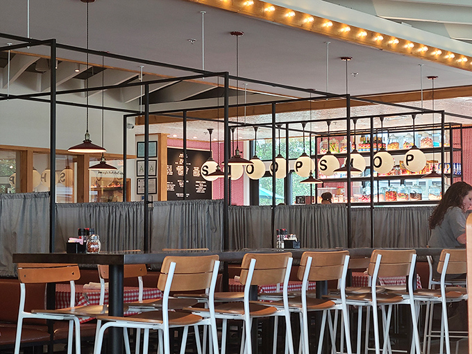 A dining room where every table feels like the best seat in the house, with globe lights illuminating future food memories.