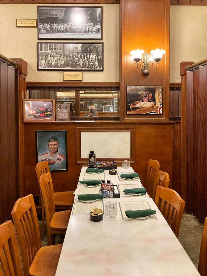 White tablecloths and wooden chairs create dining spaces where conversations flow as smoothly as the restaurant's signature sauces.