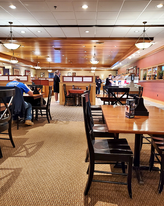 The seating area's warm tones and wooden accents create an atmosphere that says "stay awhile" rather than "eat and run."
