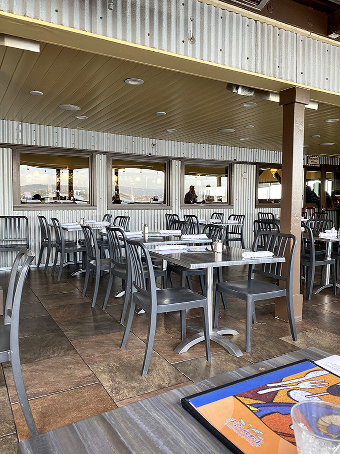 The outdoor seating area – where industrial chic meets coastal casual, and where your Instagram photos will make friends back home question their life choices.
