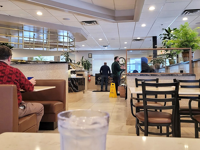 From this booth perspective, you can people-watch while anticipating your meal. The water glass stands ready for endless refills.