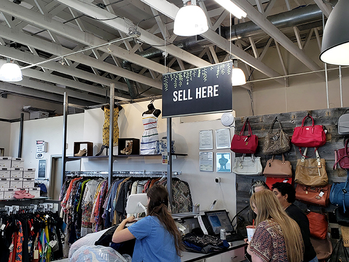 Where fashion gets its second chance. The "Sell Here" counter transforms closet cleanouts into cash or store credit&mdash;retail circle of life in action.