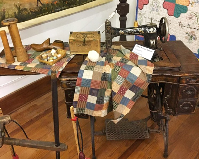 This antique sewing machine with handmade quilt reminds us that before fast fashion, clothes were investments made with care and skill.
