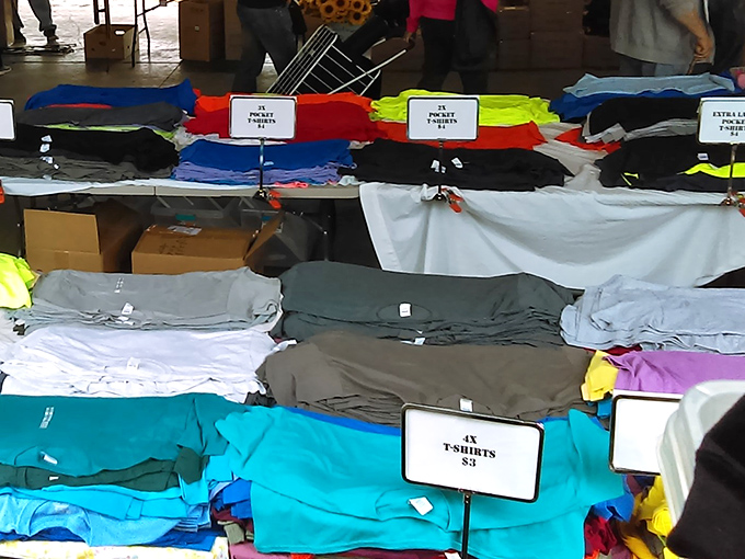 T-shirt taxonomy at its finest. The universal wardrobe staple, organized by color, awaiting your "I didn't mean to buy anything today" moment.