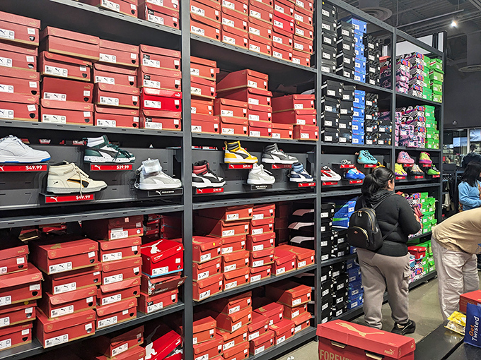 The Nike store's wall of shoes isn't just footwear &ndash; it's a temple of athletic aspiration where even couch potatoes momentarily consider running marathons.
