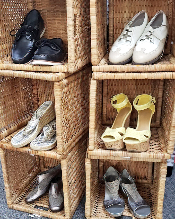Wicker cubbies showcase footwear with personalities all their own. Those yellow wedges are practically screaming "summer barbecue" while the oxfords whisper "job interview."