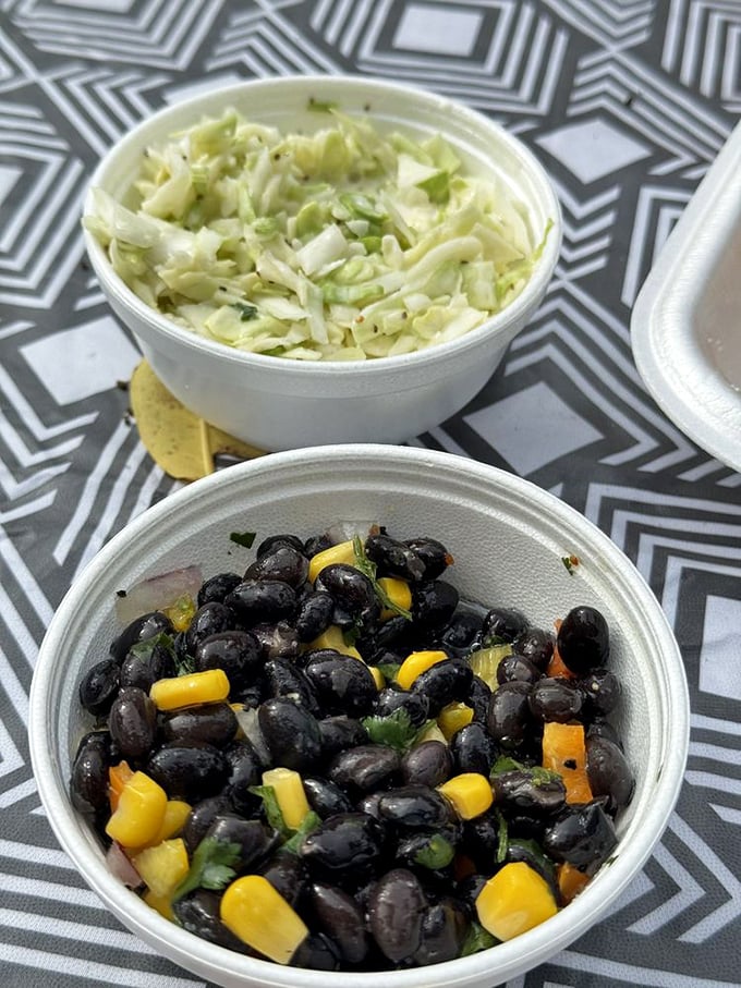 Fresh slaw and black bean salad that prove sides aren't afterthoughts. These vibrant companions complement the main attraction without being overshadowed.