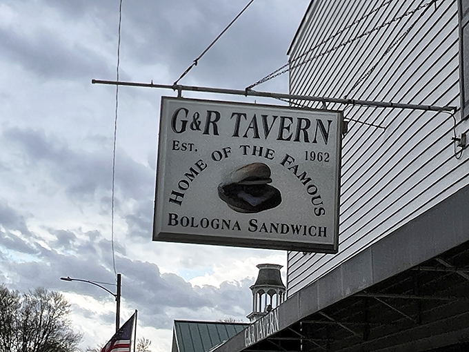 The vintage hanging sign announces your arrival at bologna paradise &ndash; simple, straightforward, and promising satisfaction since 1962.