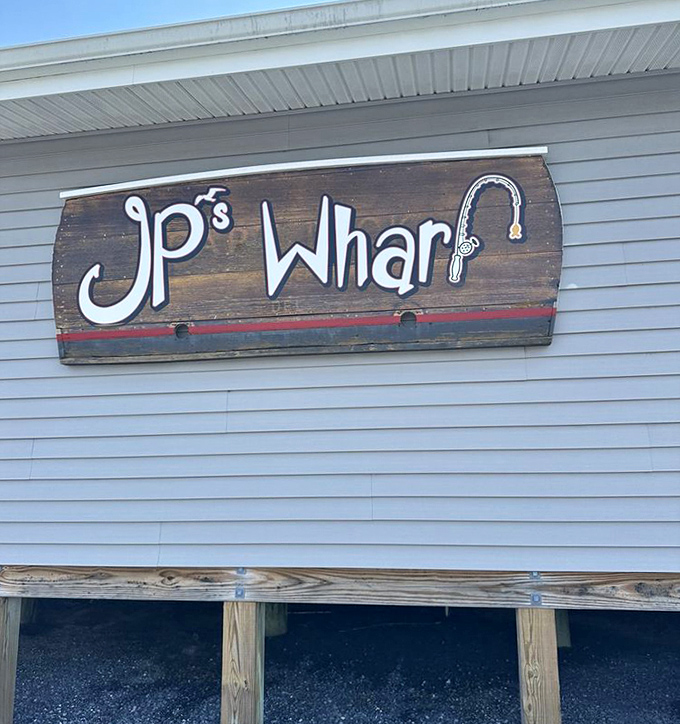 The JP's Wharf sign welcomes you with rustic charm, promising seafood adventures that'll make the drive absolutely worthwhile for anyone. Photo credit: <a href="https://www.yelp.com/user_details?userid=Q9uDr4Gh1x9ustx8bfIawA" target="_blank" rel="noopener noreferrer">Mariellen E.</a>	The JP's Wharf sign welcomes you with rustic charm, promising seafood adventures that'll make the drive absolutely worthwhile for anyone.