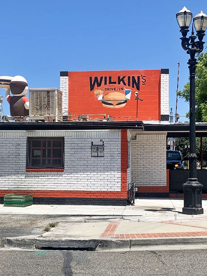 The bold red and white signage doesn't whisper &ndash; it announces proudly that you've arrived somewhere special, somewhere authentically American.