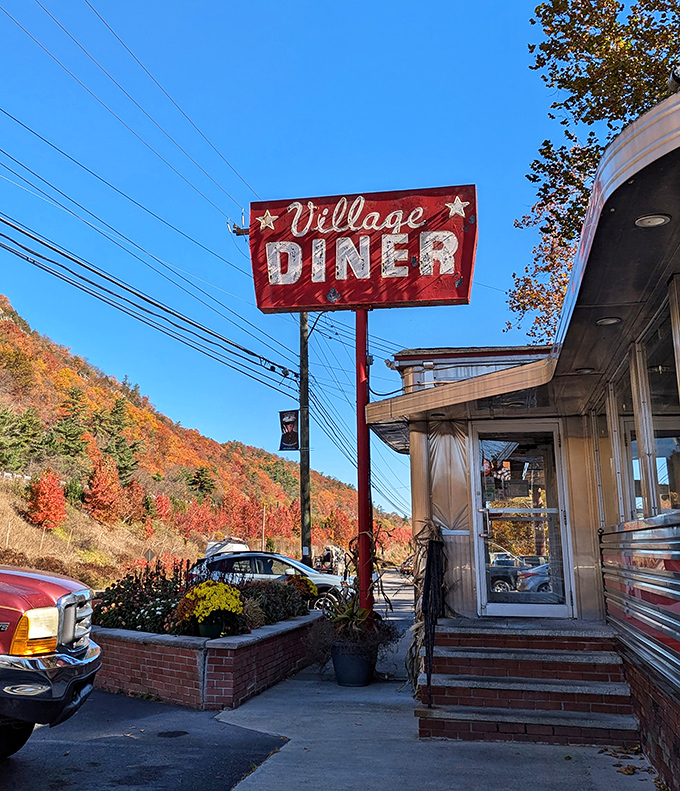 That iconic red sign against autumn foliage&mdash;like a beacon of hope for hungry travelers promising "Yes, we have breakfast all day."