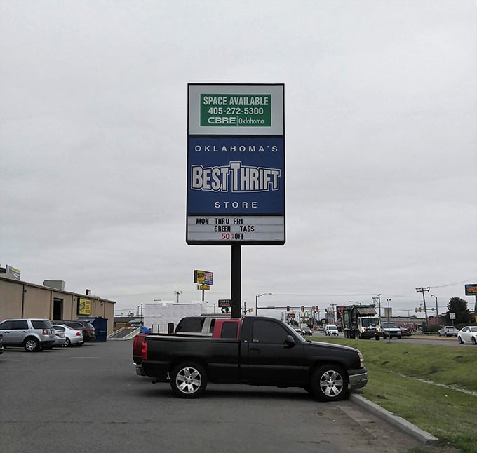 The roadside marquee announcing today's color tag specials &ndash; a beacon of hope for budget-conscious shoppers in a sea of retail conformity.