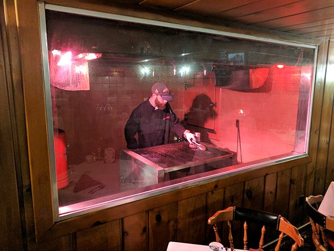 Through the window to the kitchen, you can watch the culinary choreography that transforms raw ingredients into the plates that will soon have you planning your return visit.